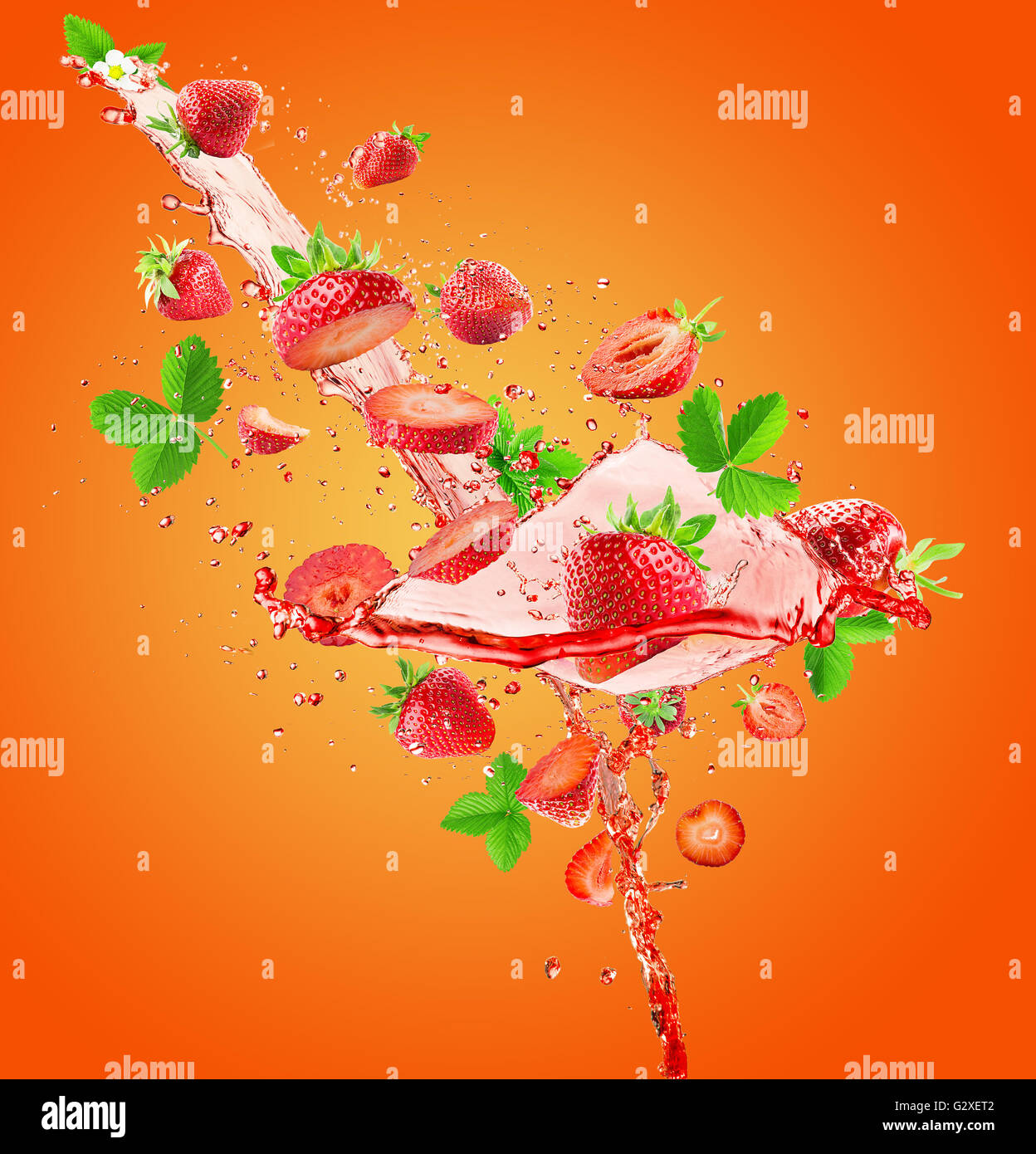 strawberry juice splash on the orange background Stock Photo - Alamy