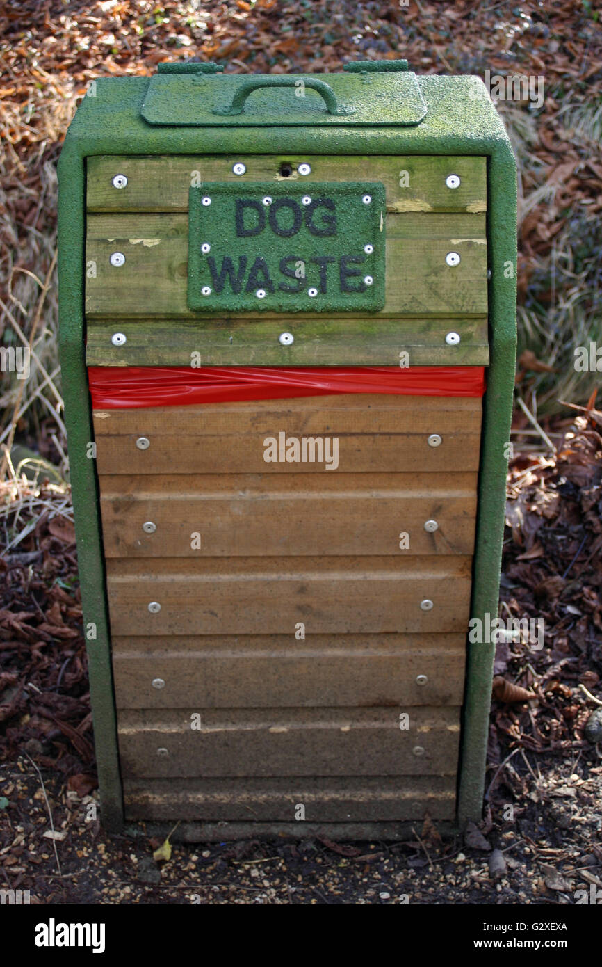 Green wooden dog waste bin Stock Photo - Alamy
