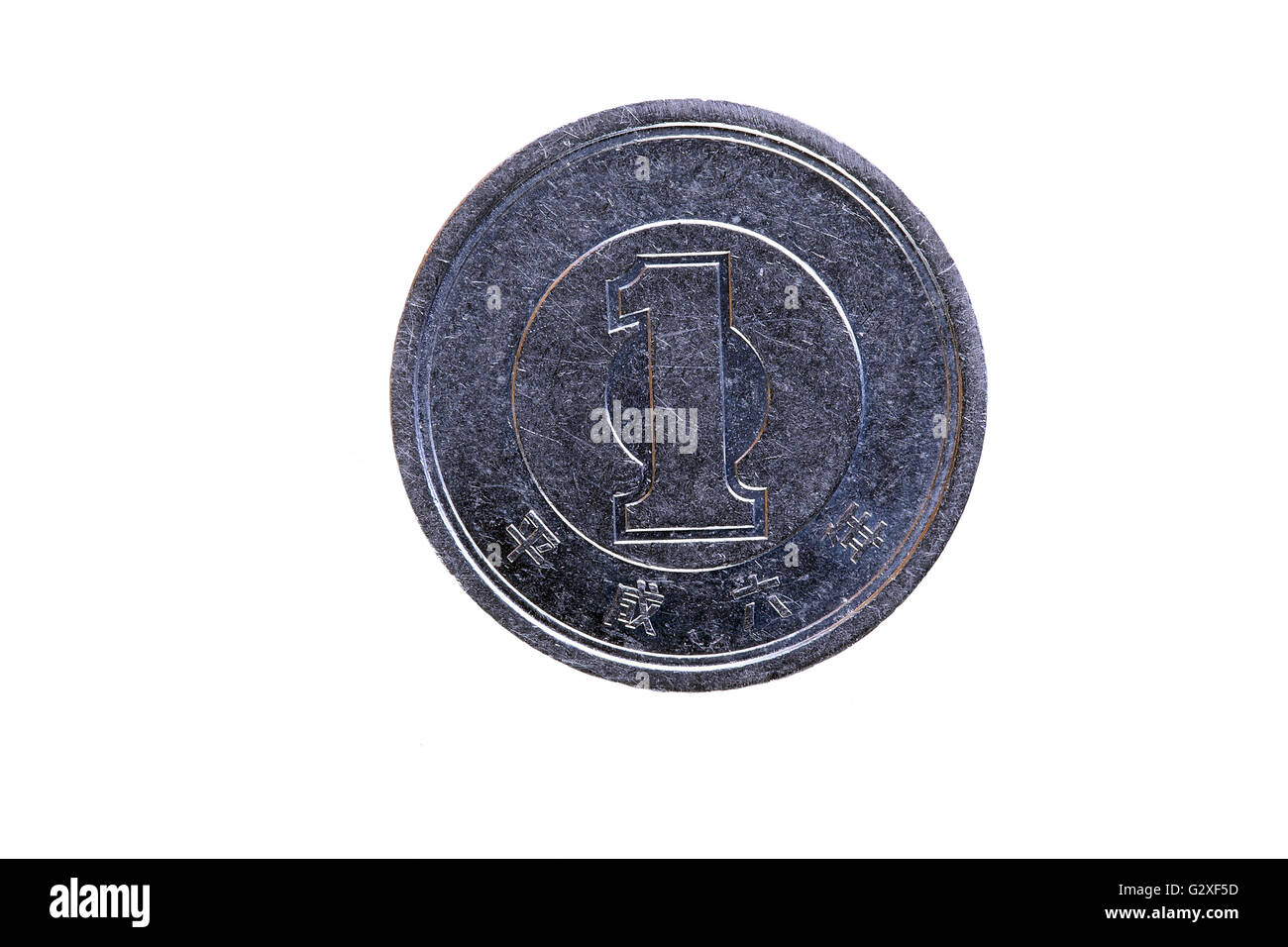 one yen coin against white background showing numeral and characters ...
