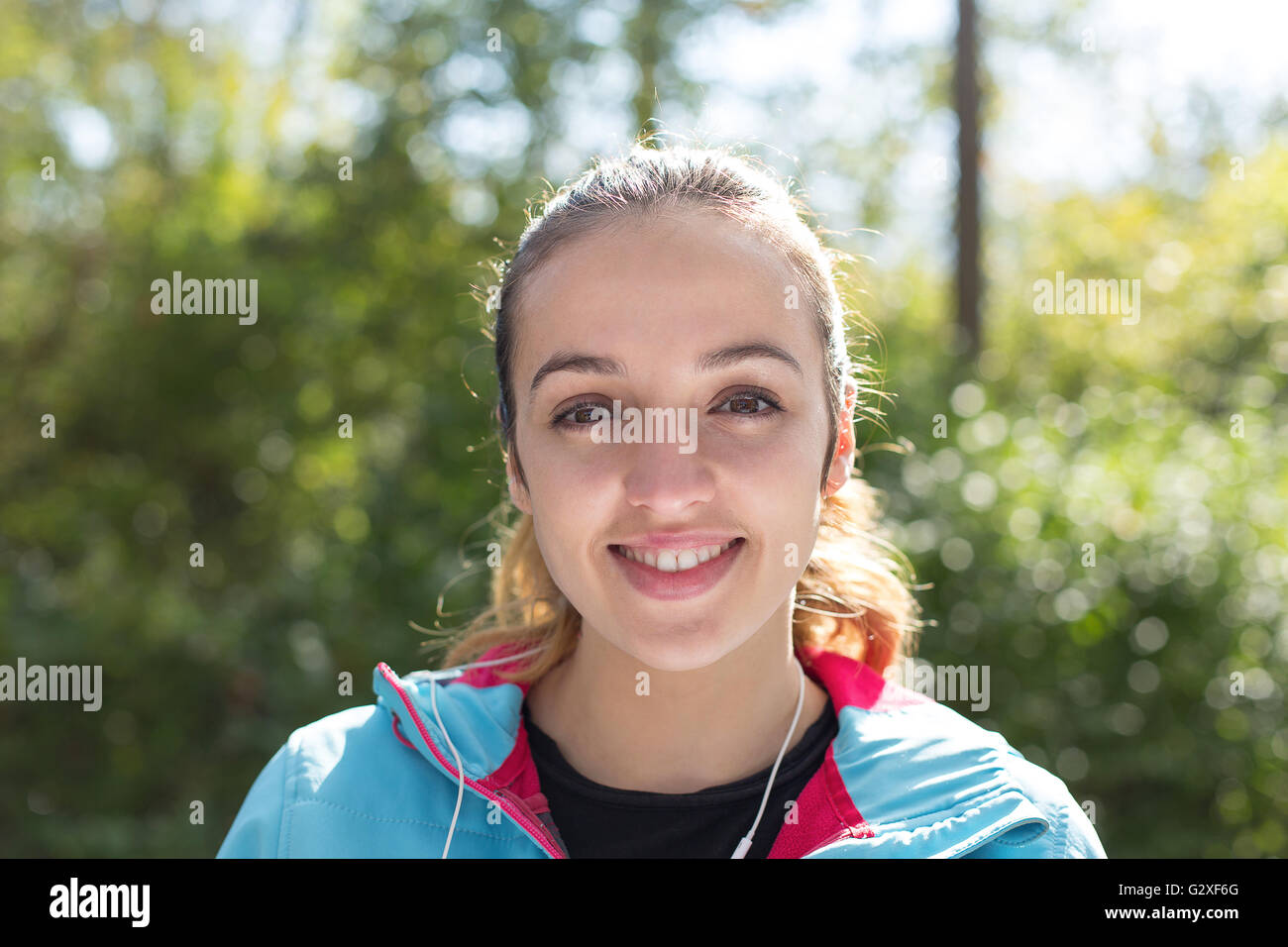 Closeup of a female runner smiling Stock Photo - Alamy