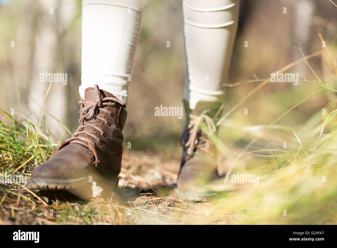 feet in shoes on a forest path Stock Photo - Alamy