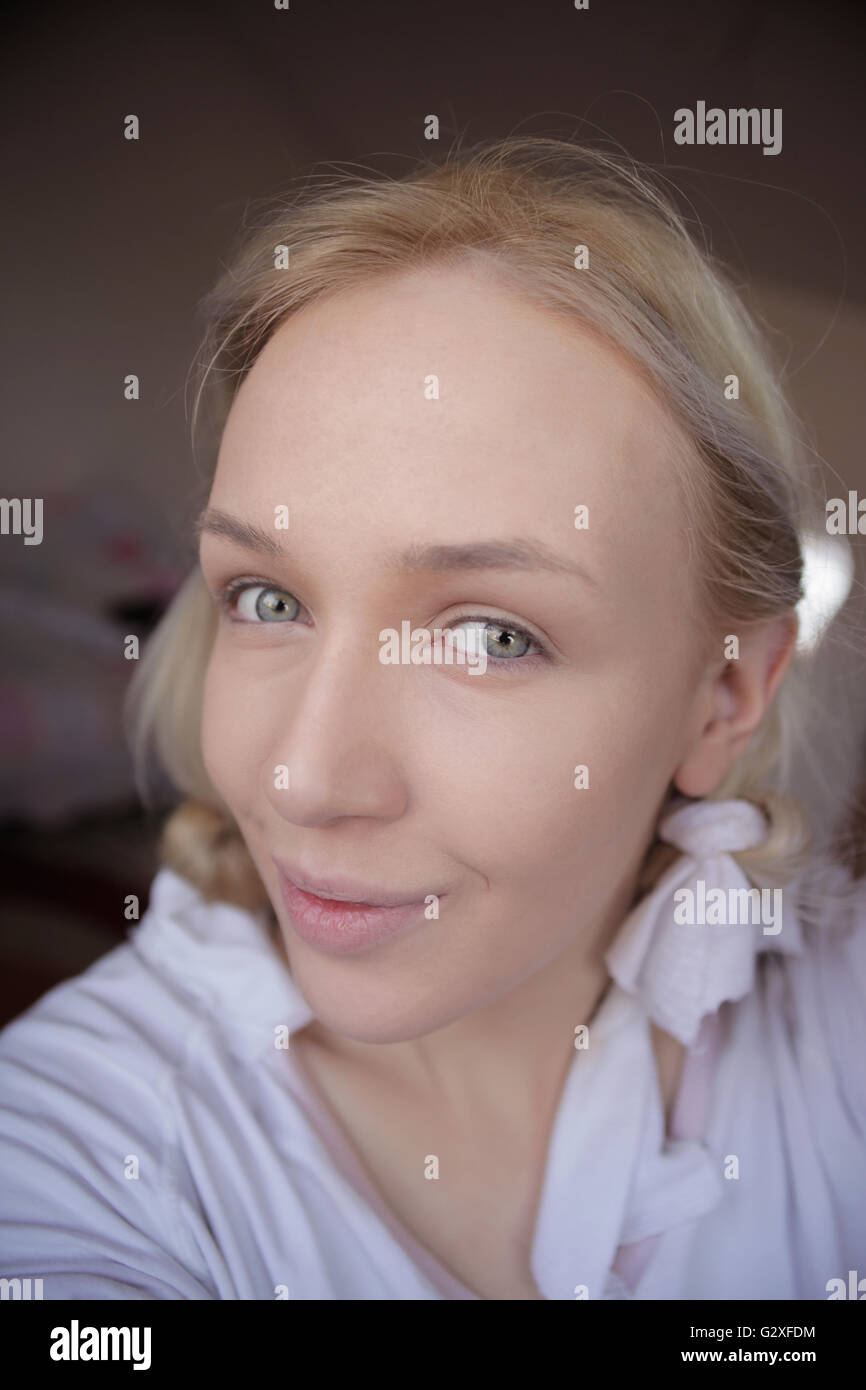 Portrait of beautiful blonde girl taking selfie Stock Photo - Alamy