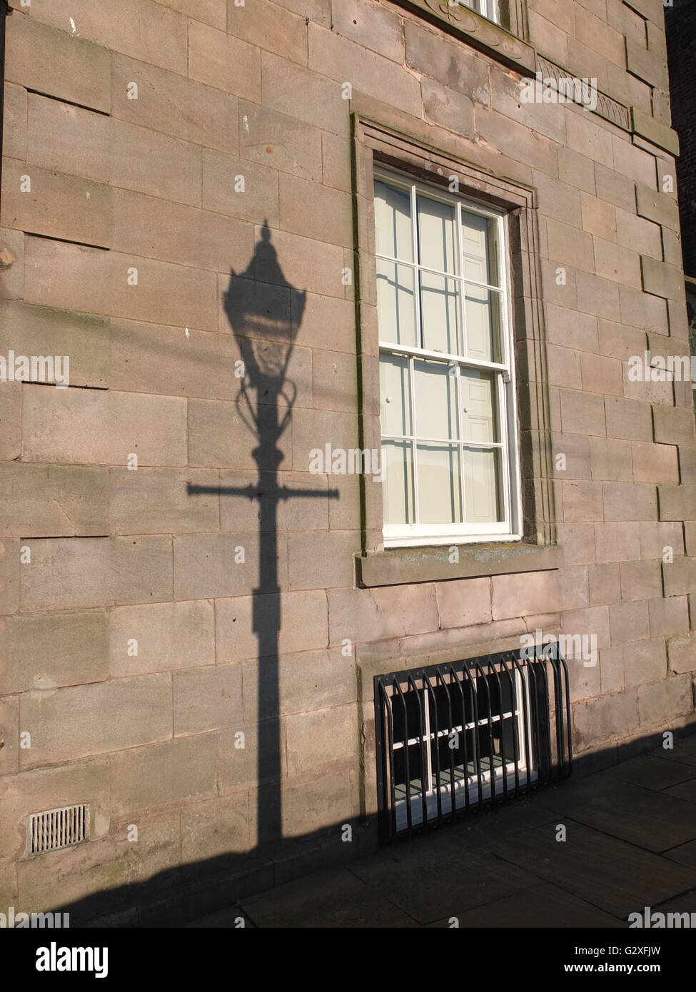 Shadow of a lamp post on wall at Berwick on Tweed , Northumberland ...