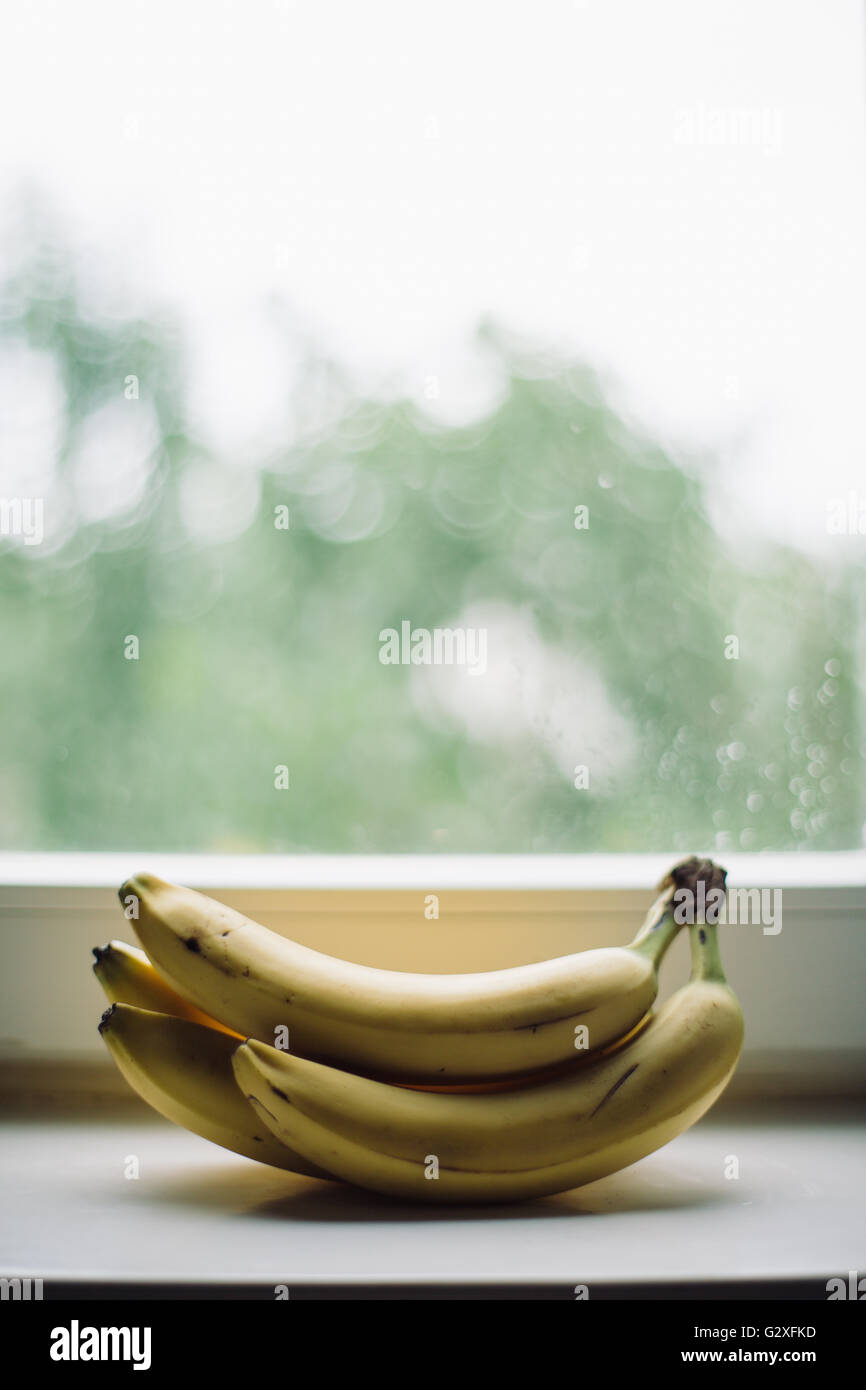 bunch of bananas on the window Stock Photo - Alamy
