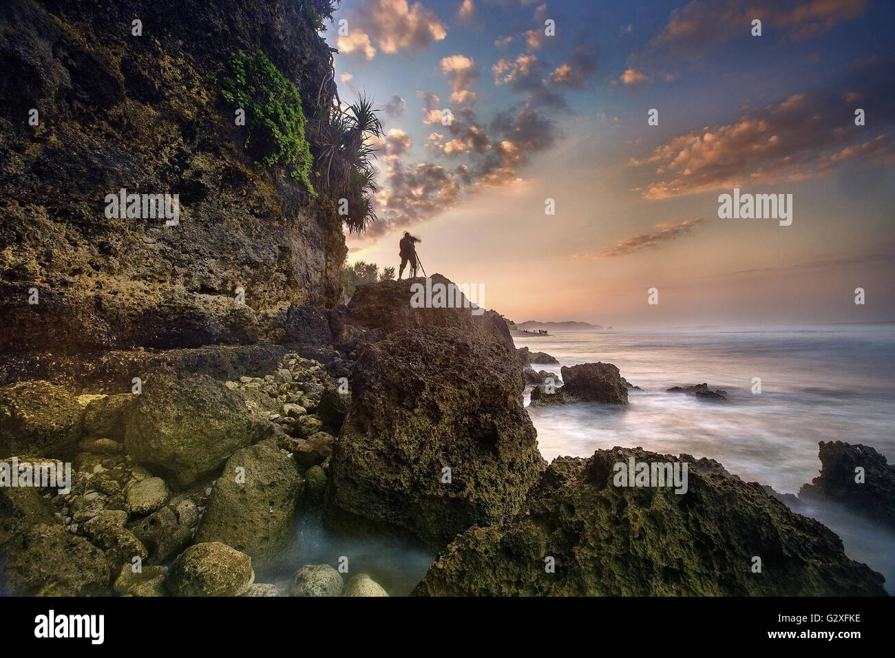 Seacape during sunset with mossy rock at Klayar Beach, Yogyakarta ...