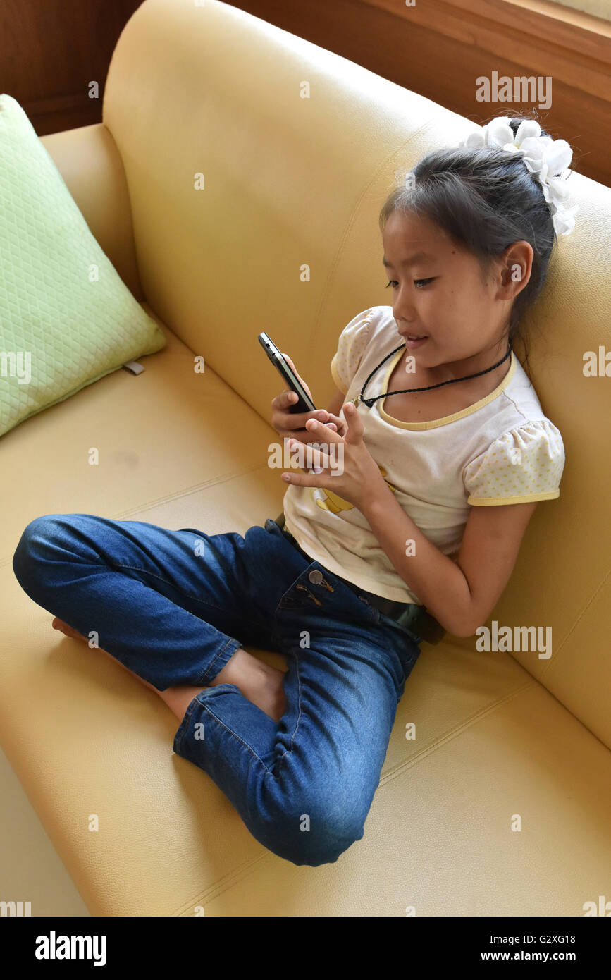 Laos, girl with mobile phone Stock Photo - Alamy