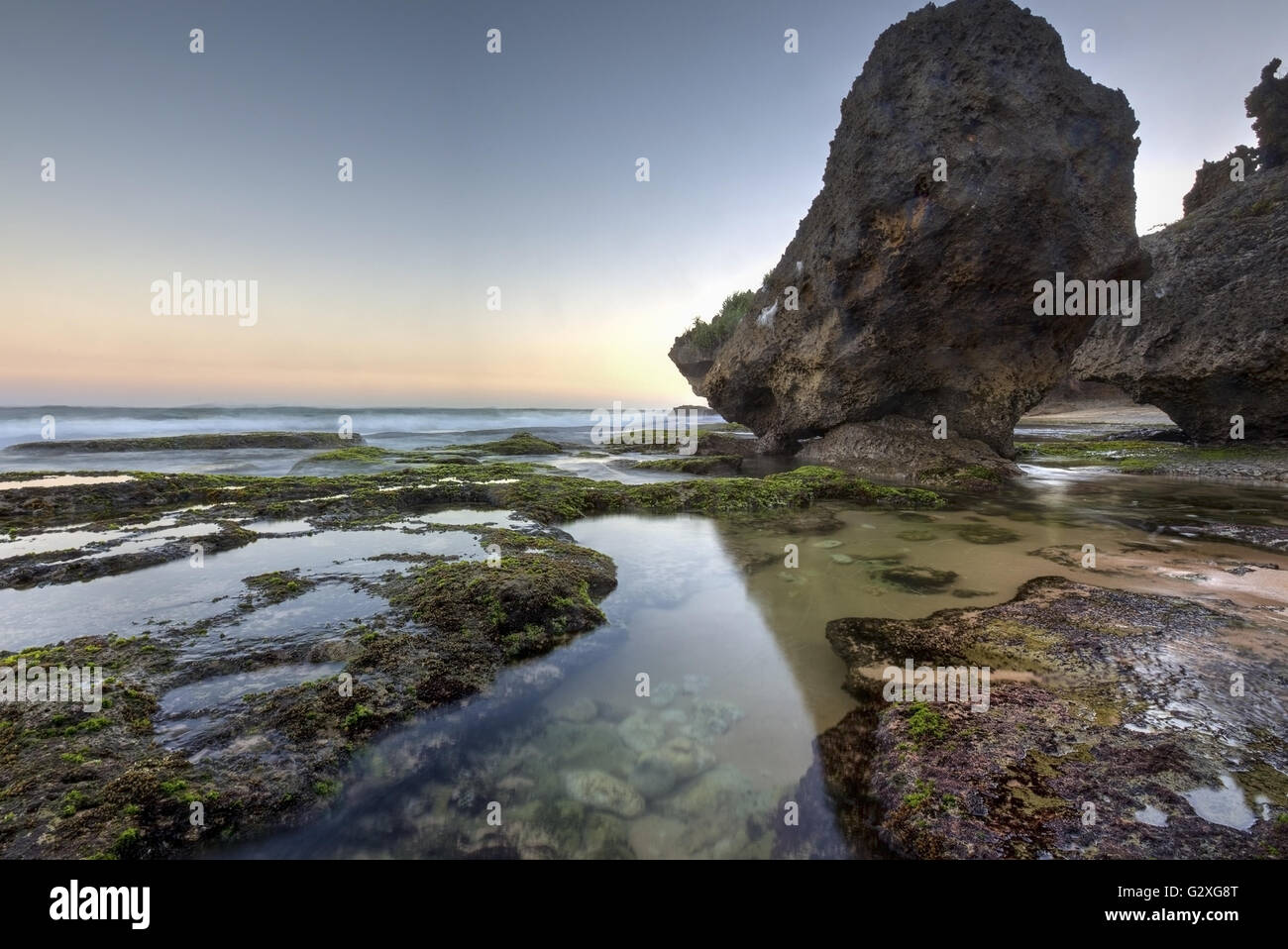 Seacape with mossy rock at Klayar Beach, Yogyakarta, Indonesia Stock ...
