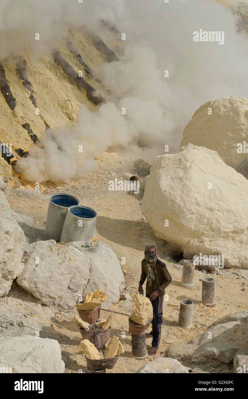 Java, Mt. Ijen, Male Sulfur Mine Worker extracting Sulfur blocks from ...
