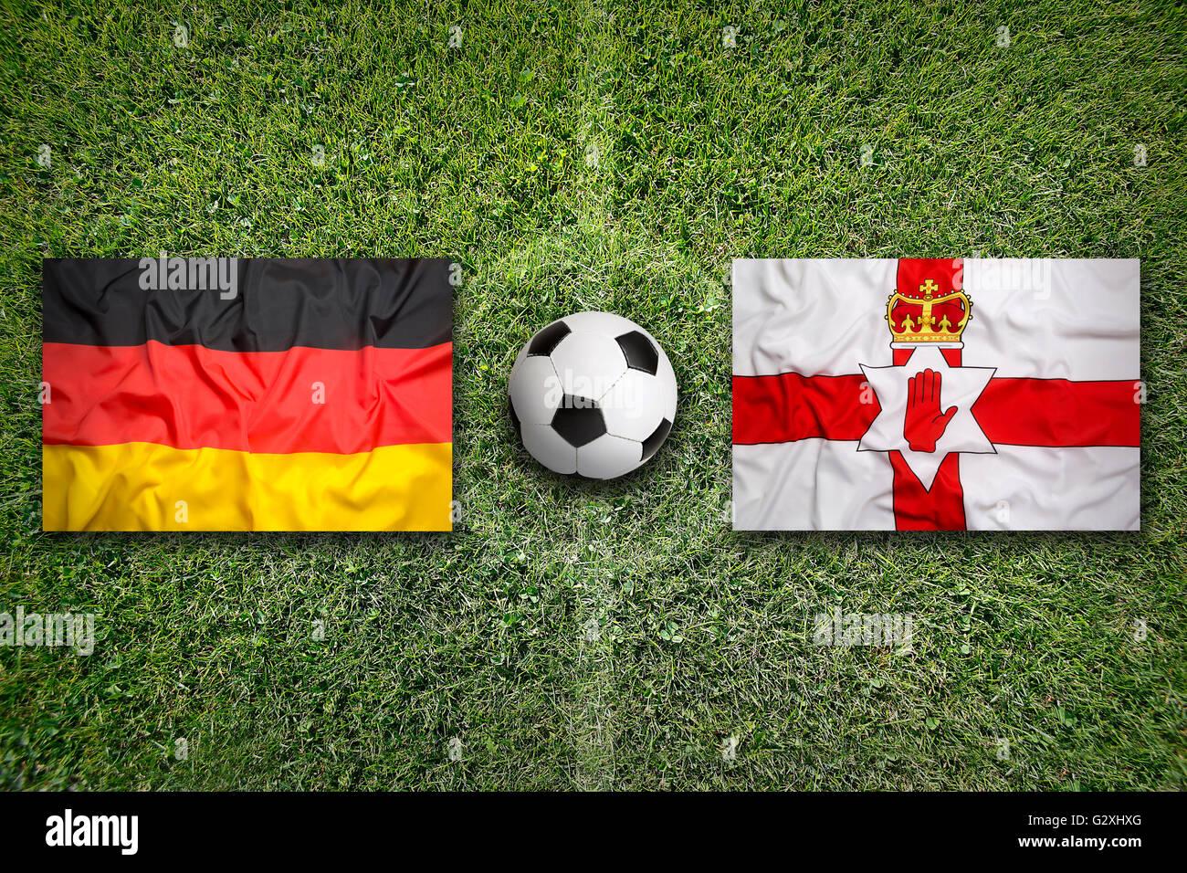 Germany vs. Northern Ireland flags on a green soccer field Stock Photo ...