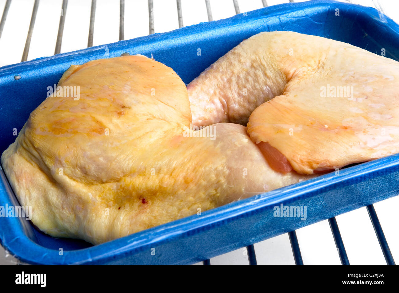 chicken legs in a supermarket presentation tray Stock Photo - Alamy