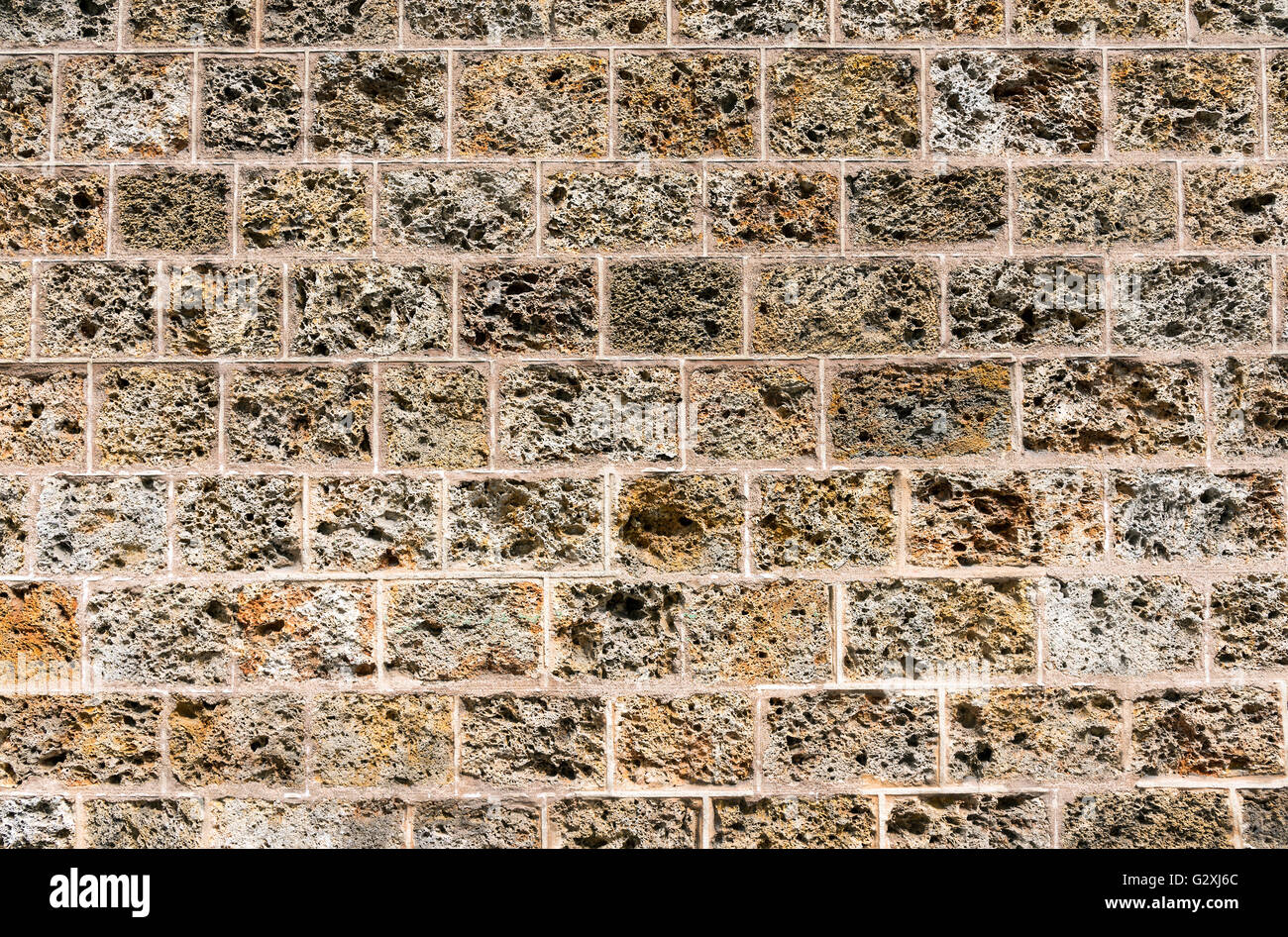 Background from an old natural tuff stone wall Stock Photo - Alamy