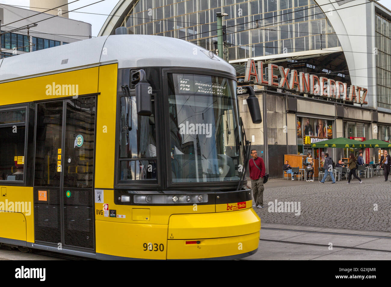 A yellow Berlin Tram outside Alexanderplatz station in the Mitte ...