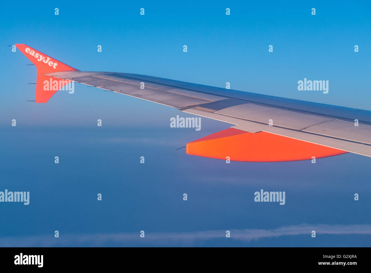 The wing tip of and easyJet Airbus plane flying over Europe Stock Photo ...