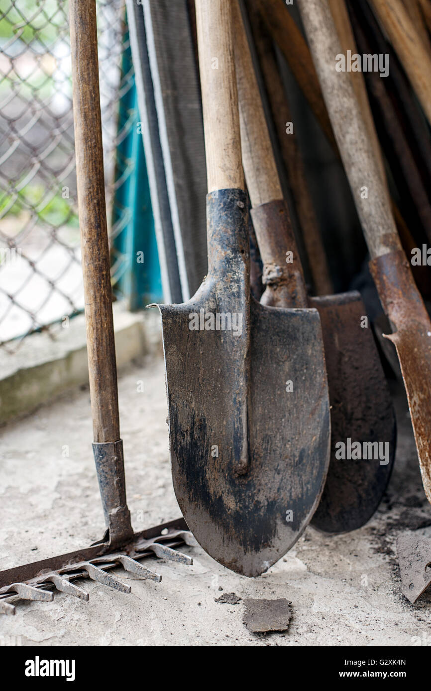 old shovels rakes Tool for working in the garden Stock Photo - Alamy