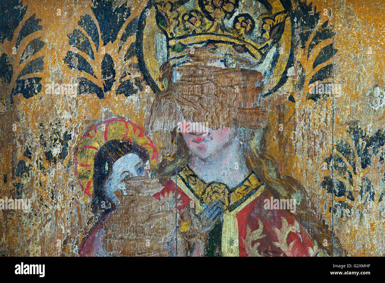 Detail of defaced screen in St Mary's Church, in the village of Great ...