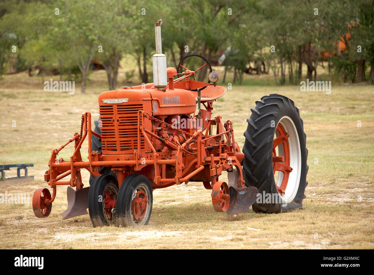 Old farm tractor and farm equipment Stock Photo - Alamy