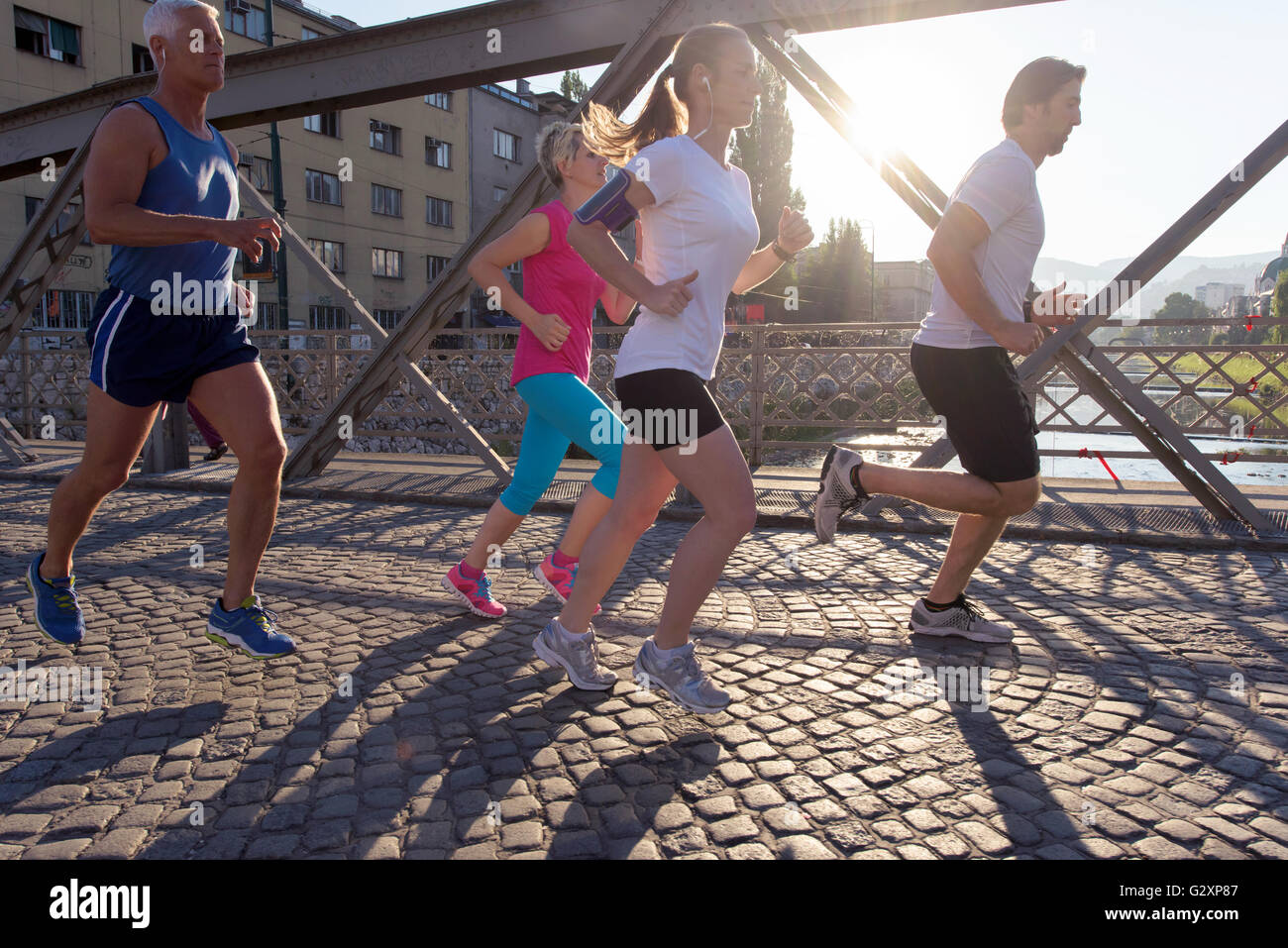 people group jogging runners team on morning training workout with ...