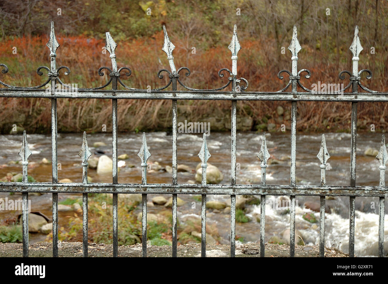 Old devastated iron fence on river bank Stock Photo - Alamy