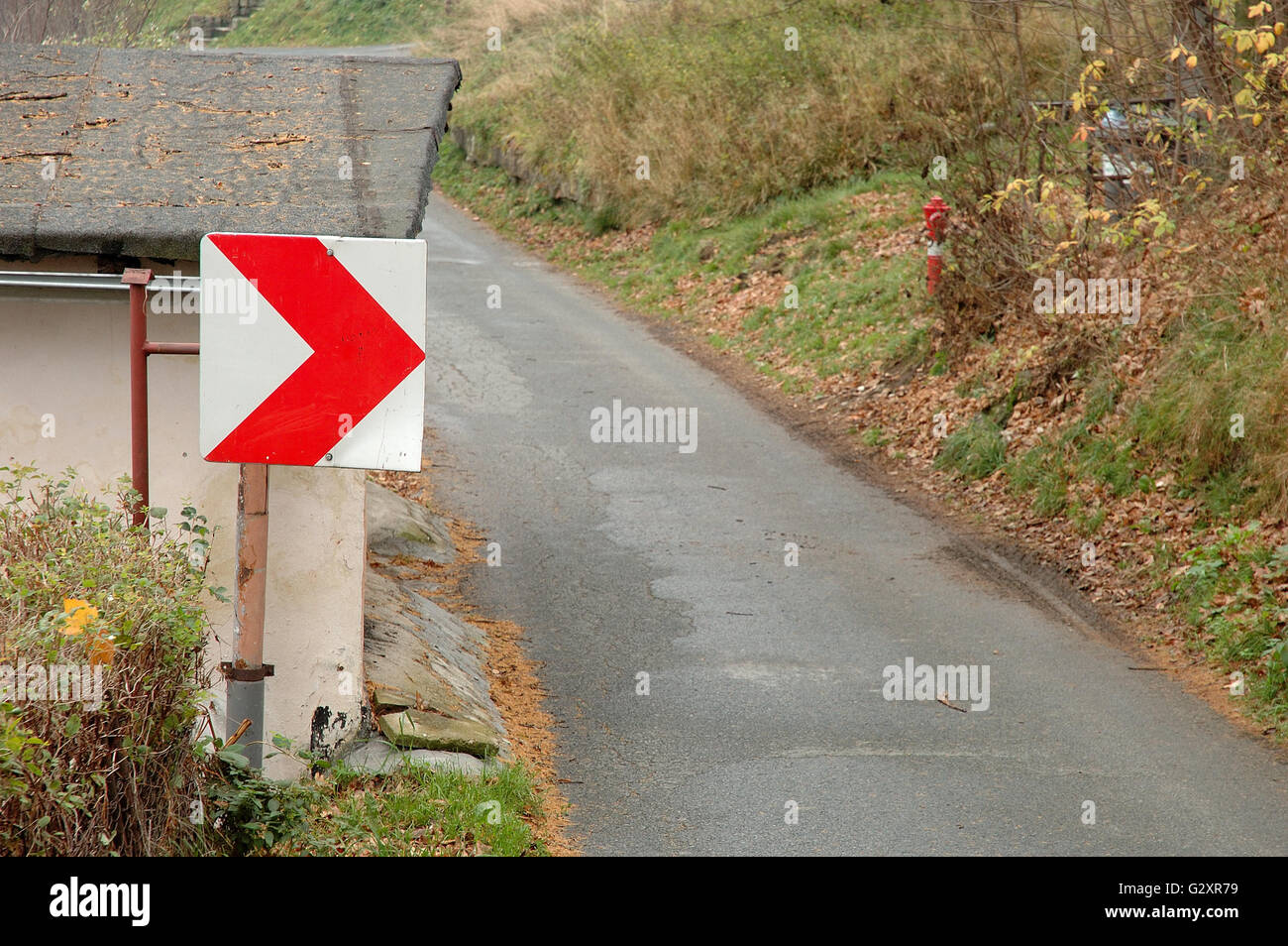 Narrowing road sign somewhere in village in Poland Stock Photo - Alamy