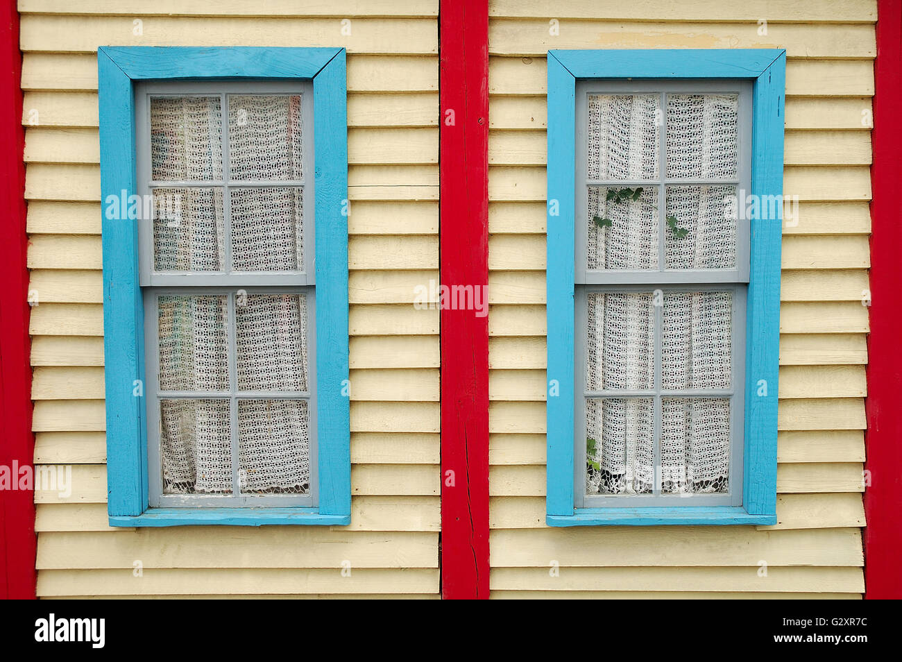 Wooden wall with two windows Stock Photo - Alamy