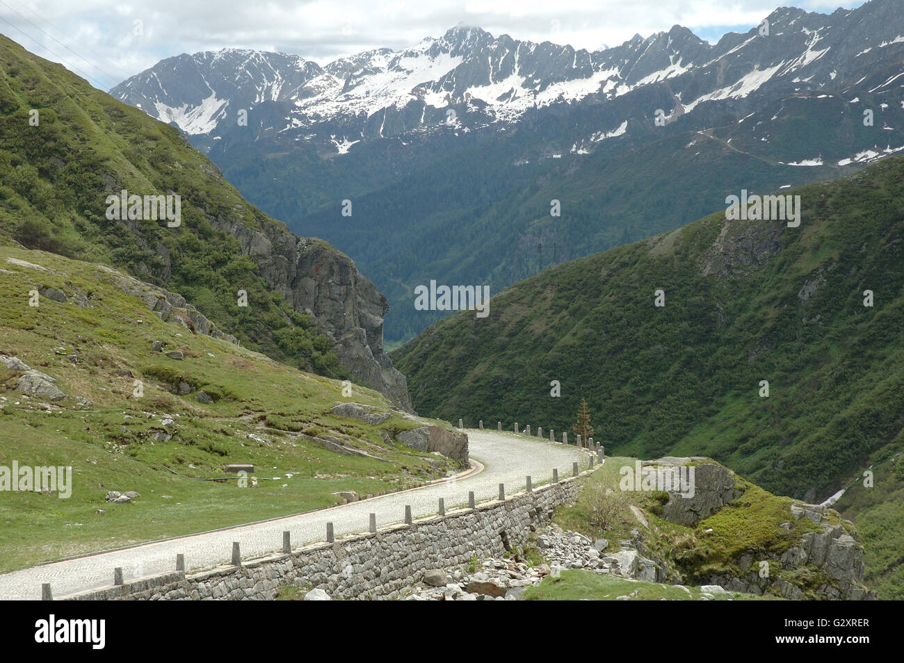 Road high in Alps mountains Stock Photo - Alamy
