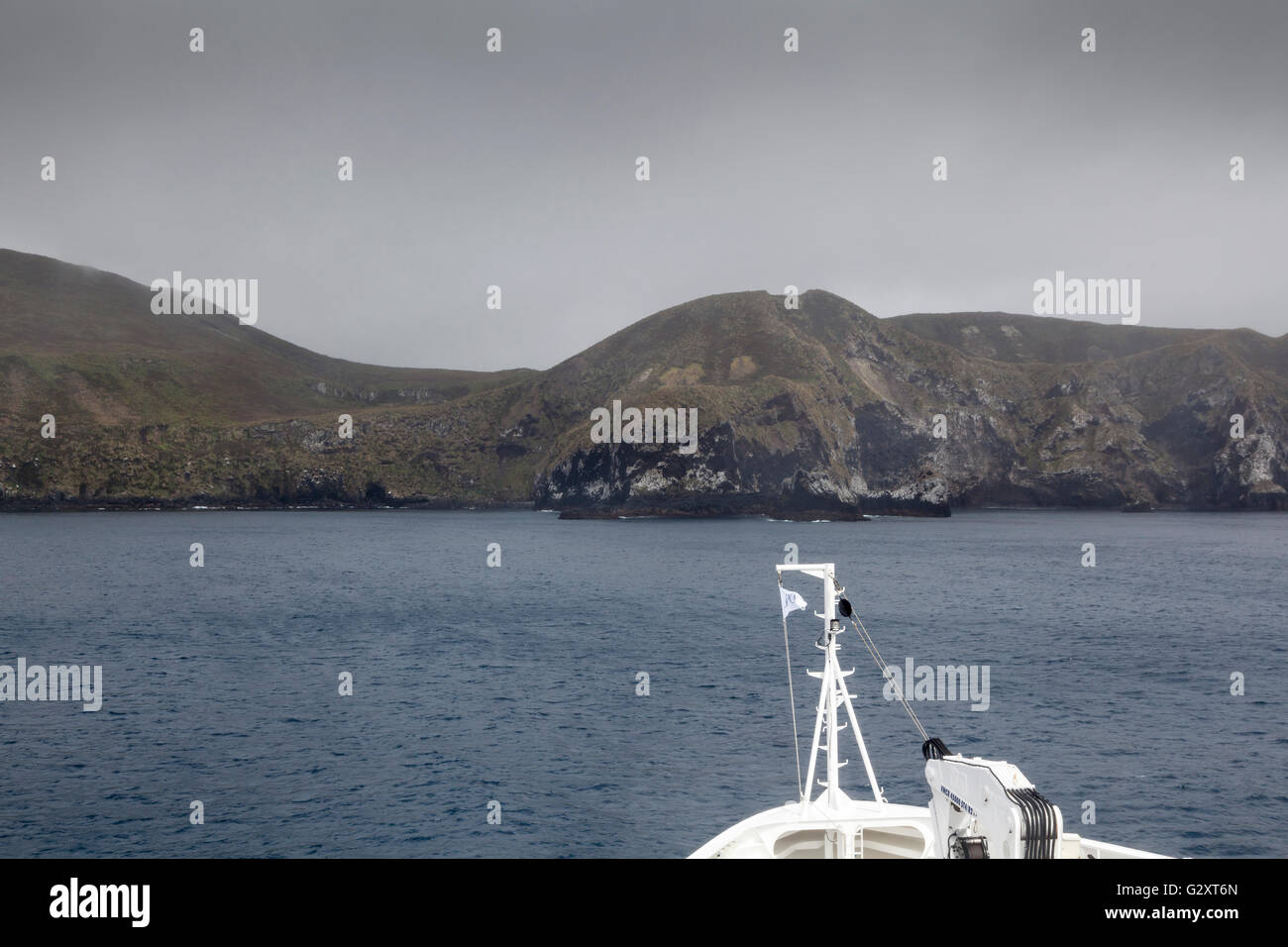 Antipodes Island with expedition ship flagpole in foreground, New ...