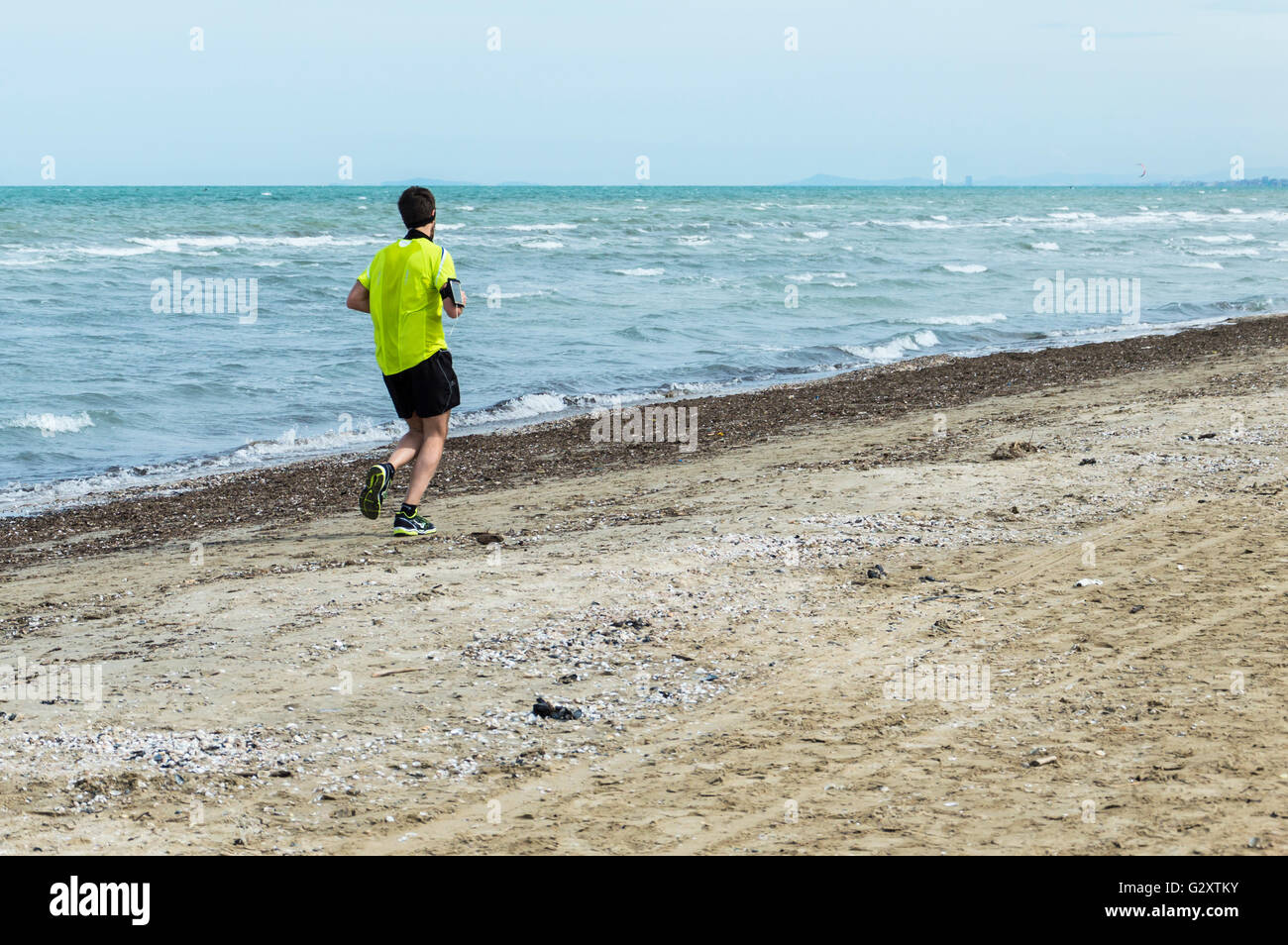 Runner on the beach Stock Photo - Alamy