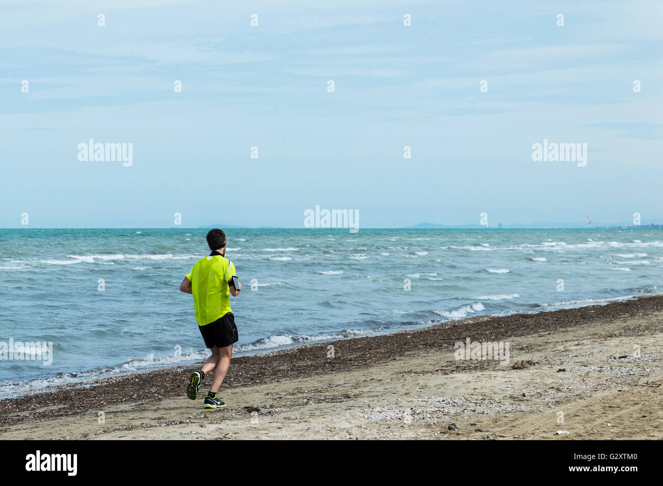 Runner on the beach Stock Photo - Alamy