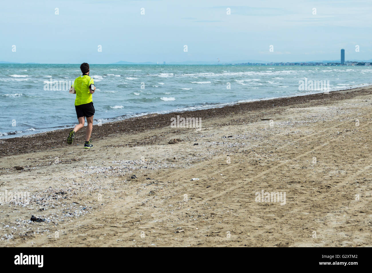 Runner on the beach Stock Photo - Alamy