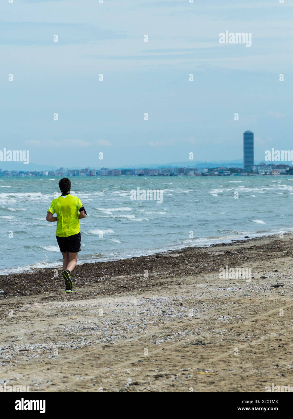 Runner on the beach Stock Photo - Alamy