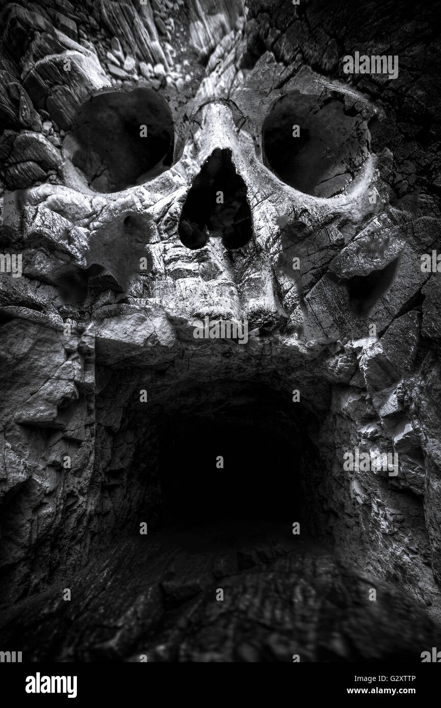 cave in the mountains, a human skull. fantastic picture Stock Photo - Alamy