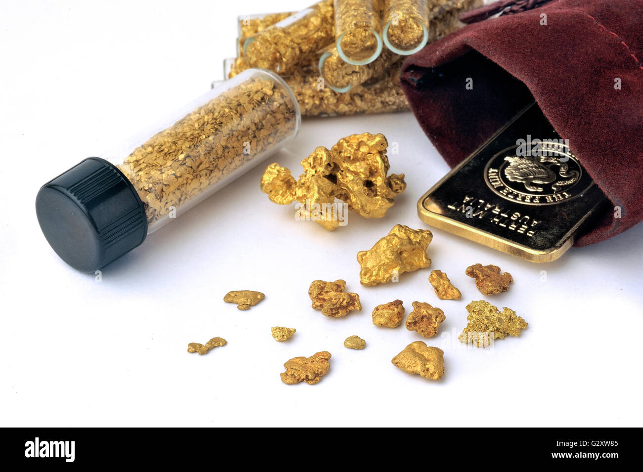 nuggets and gold bullion in studio on white background Stock Photo - Alamy