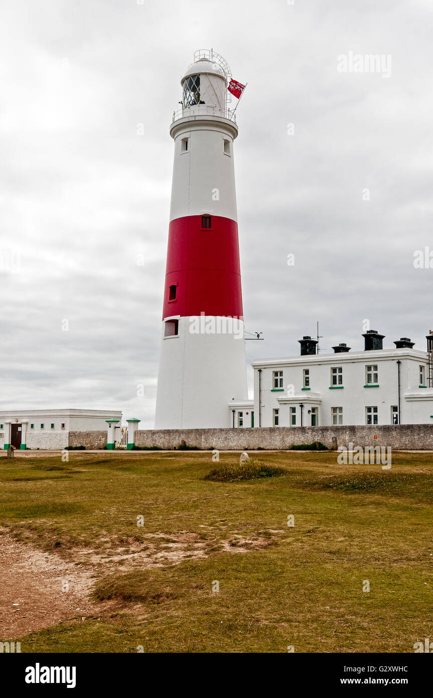 The tall red and white working lighthouse with its attached keepers ...