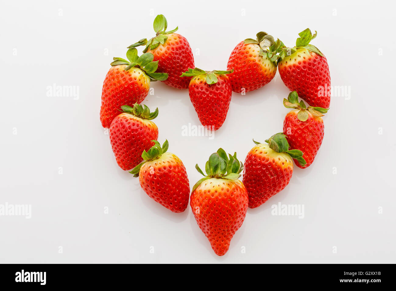Closeup of fresh strawberries in heart shape Stock Photo - Alamy