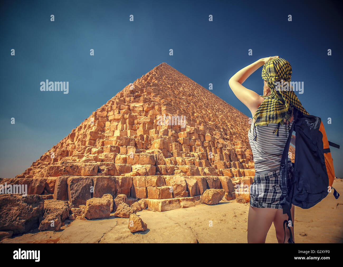 woman traveler with a backpack and the pyramids at Giza, Cairo. Egypt ...