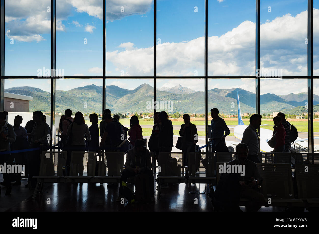 Silhouette queue people waiting in line for airplane in terminal with ...