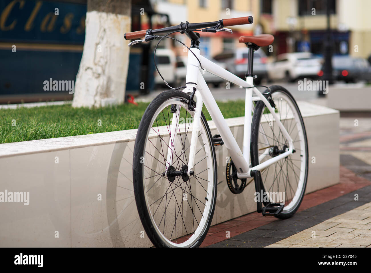white fixed-gear bicycle on street Stock Photo - Alamy