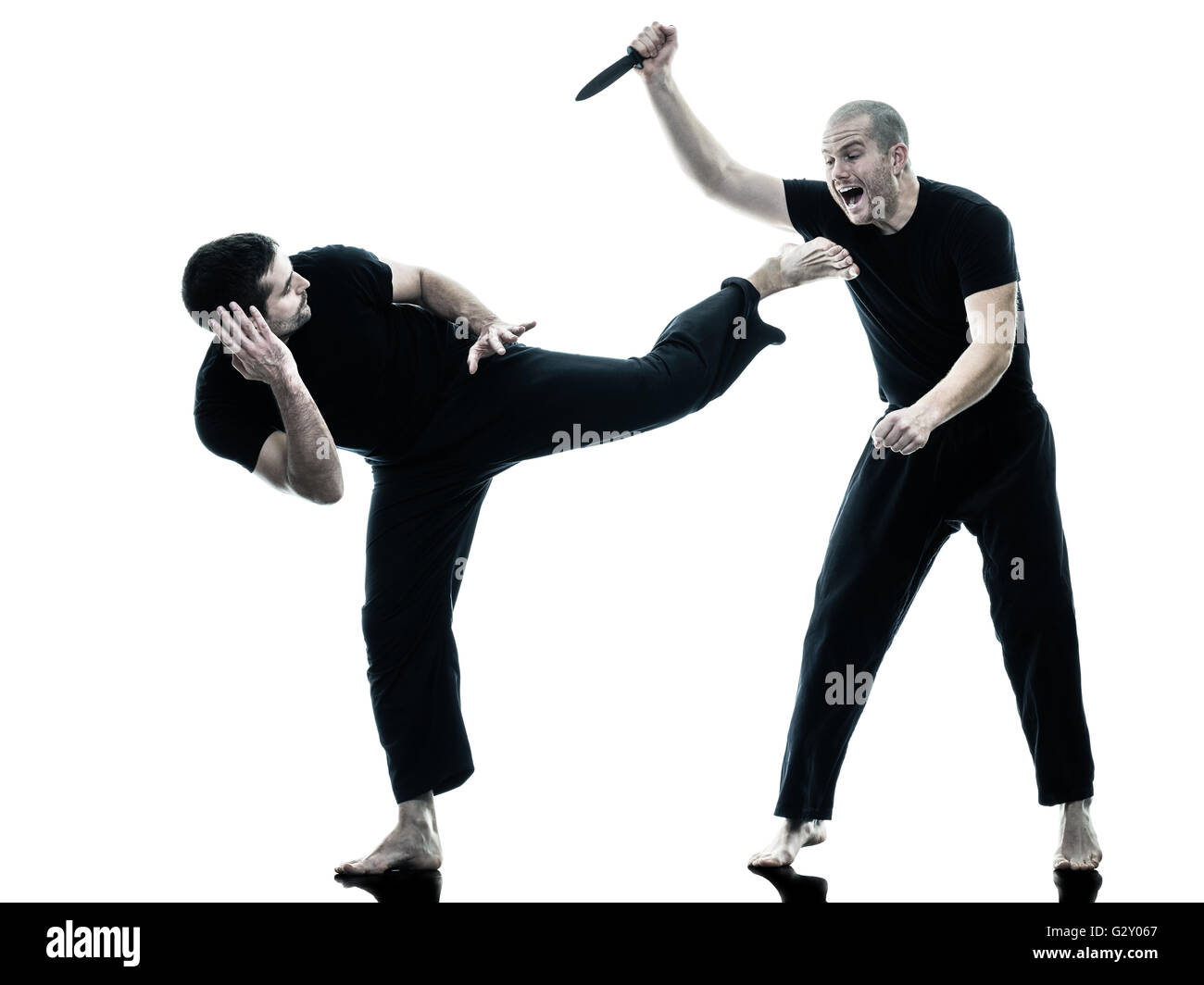 two caucasian men krav maga fighters fighting isolated silhouette on ...