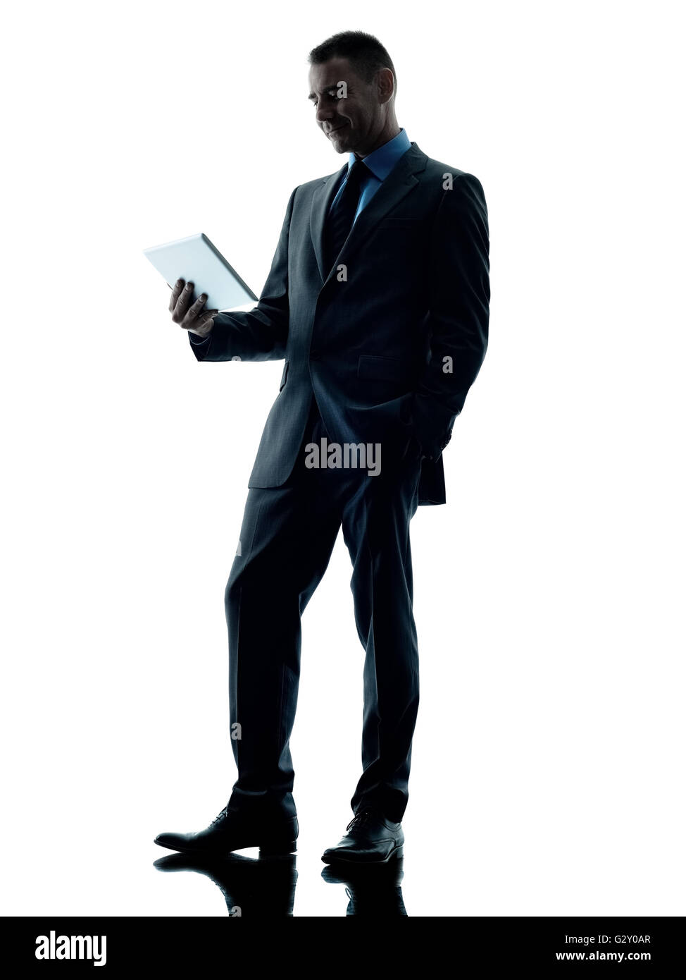 one caucasian business man standing using digital tablet silhouette ...