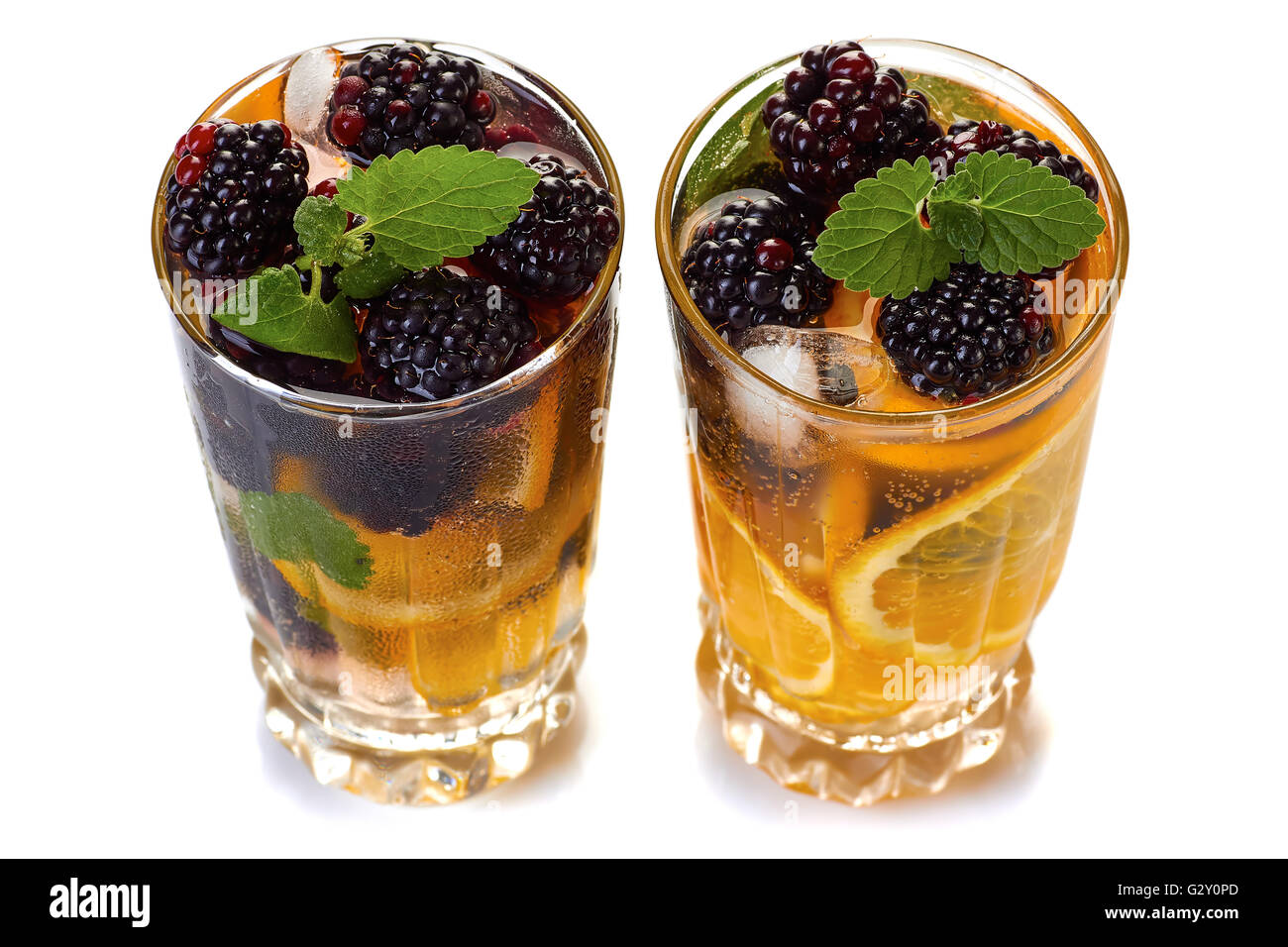Two refreshing fruit drinks on white Stock Photo - Alamy