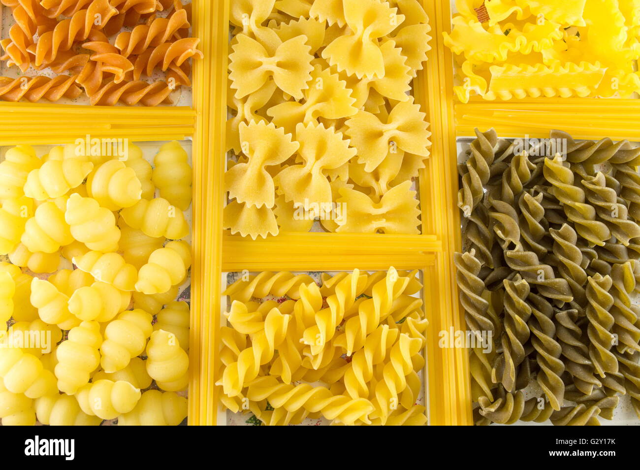 Pasta mix arranged on a stone table Stock Photo - Alamy