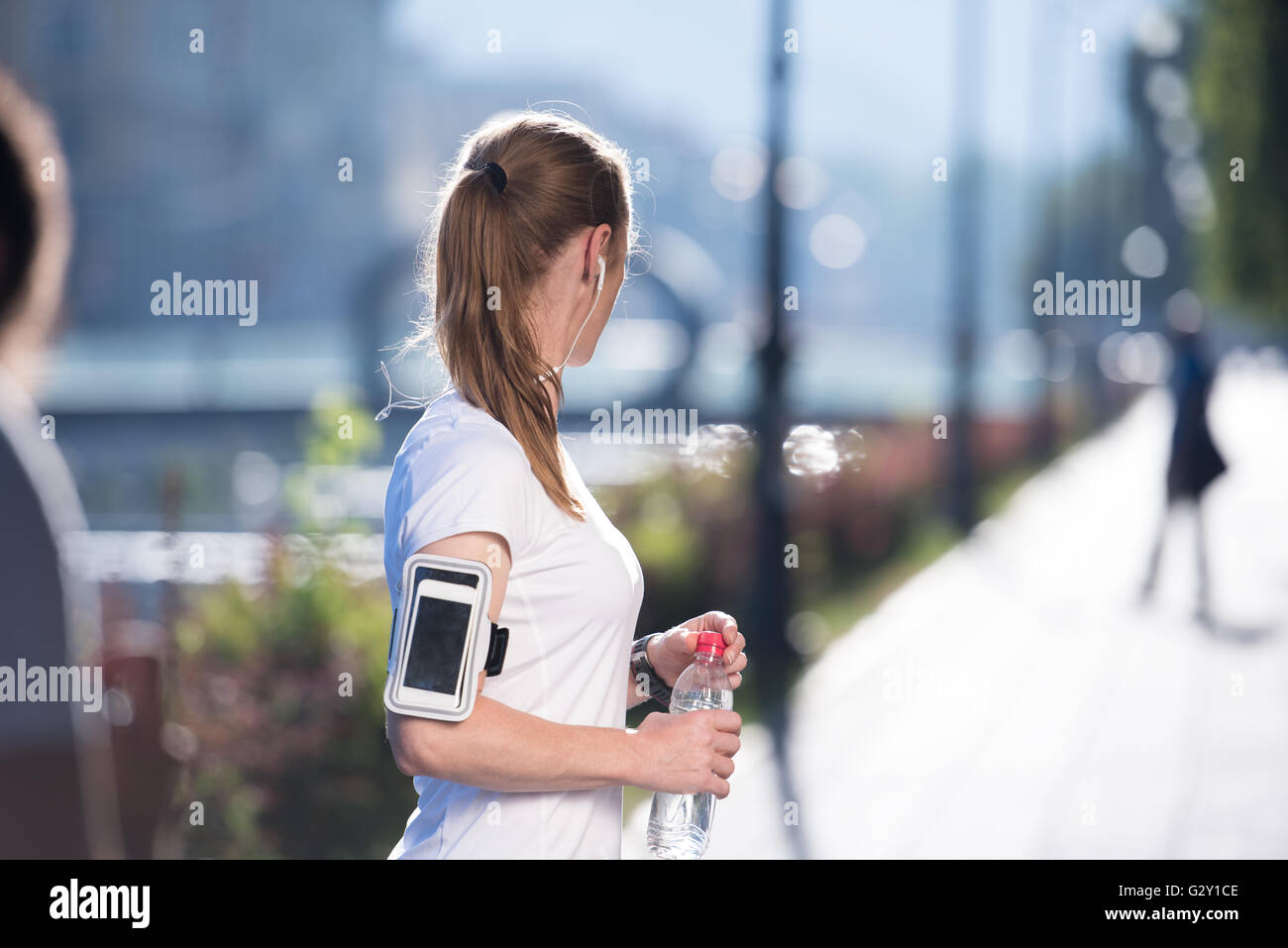 portrait of jogging woman before running on early morning with sunrise ...