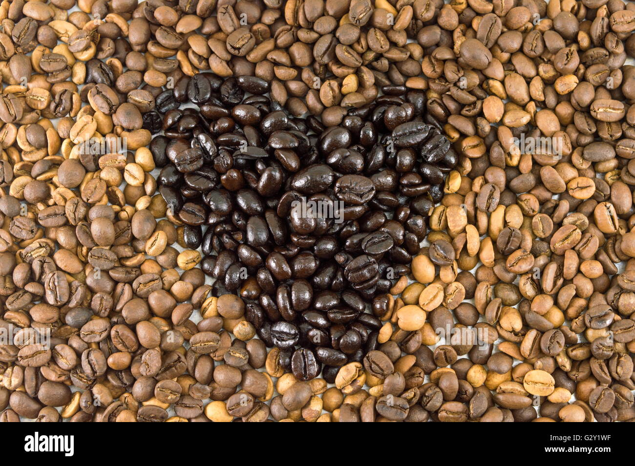 Bunch of Roasted coffee beans forming background Stock Photo - Alamy