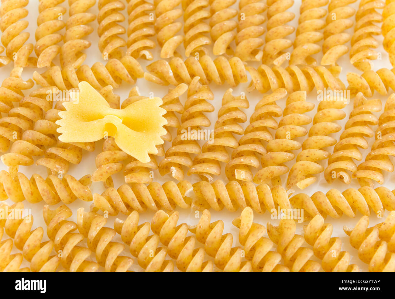 Bunch of golden colored macaroni pasta on a table Stock Photo - Alamy