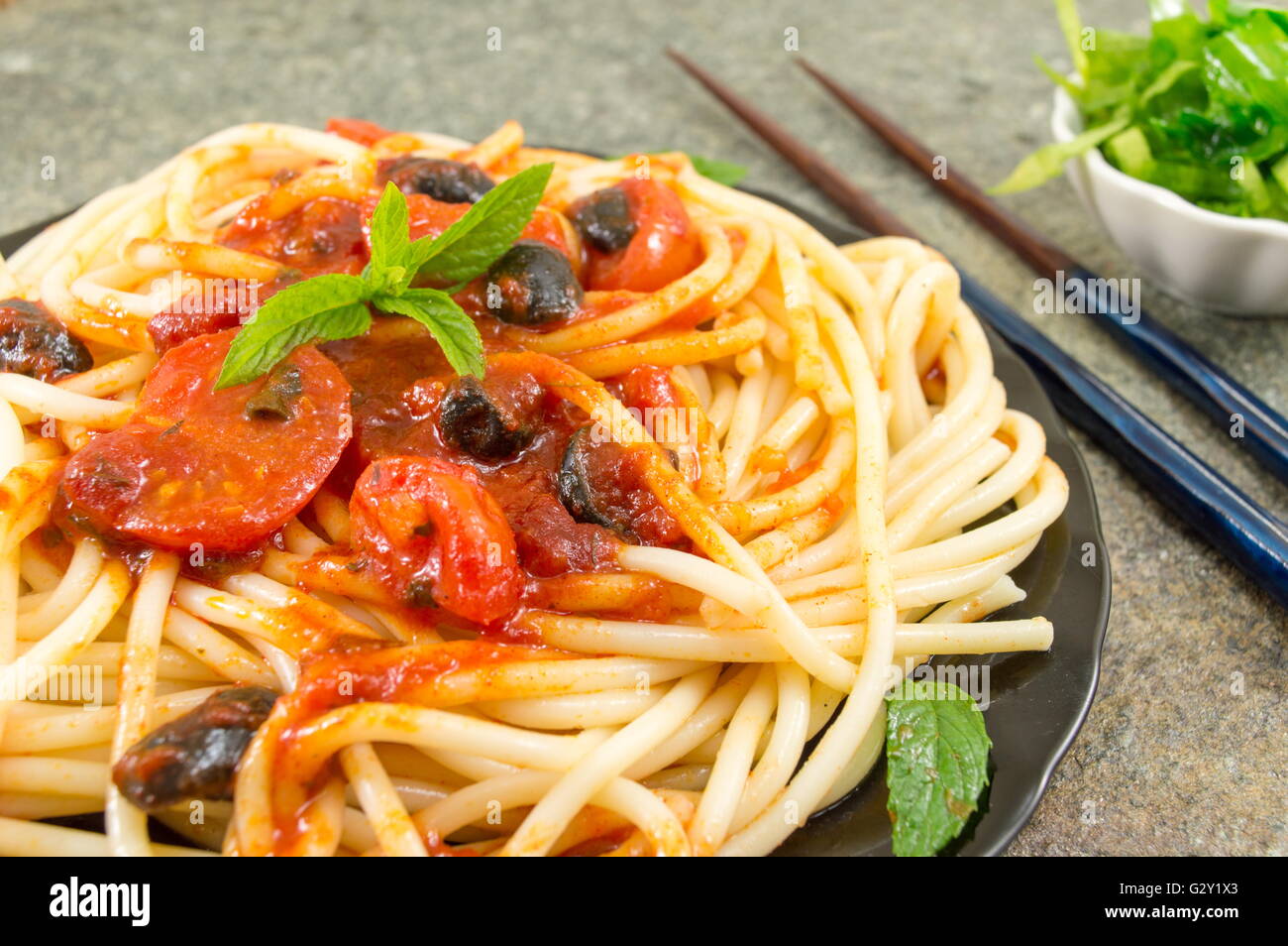 Spaghetti served with ketchup, cheese, vegetables and parsley Stock ...