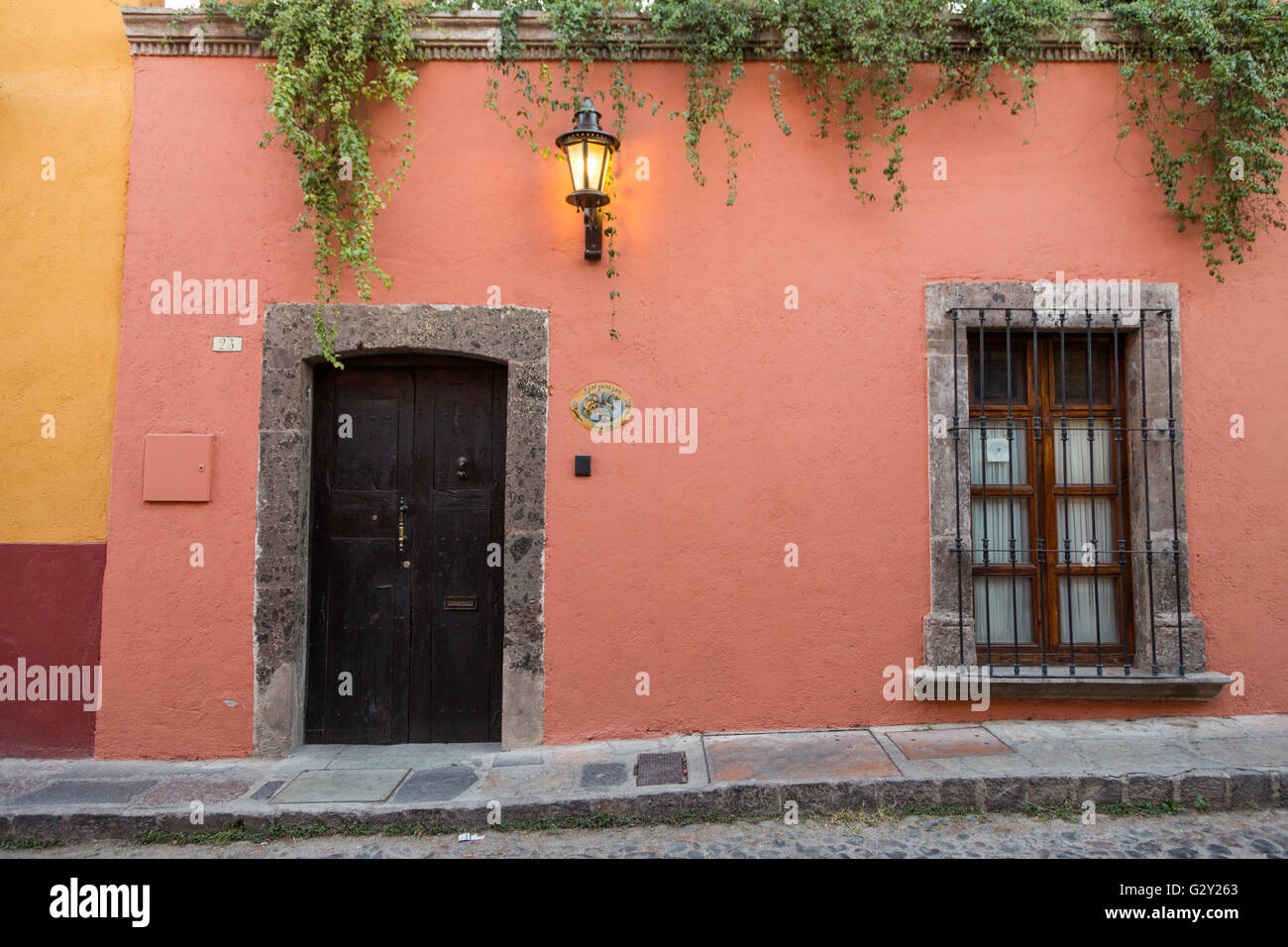 Spanish colonial style home and old wooden door in the historic center ...