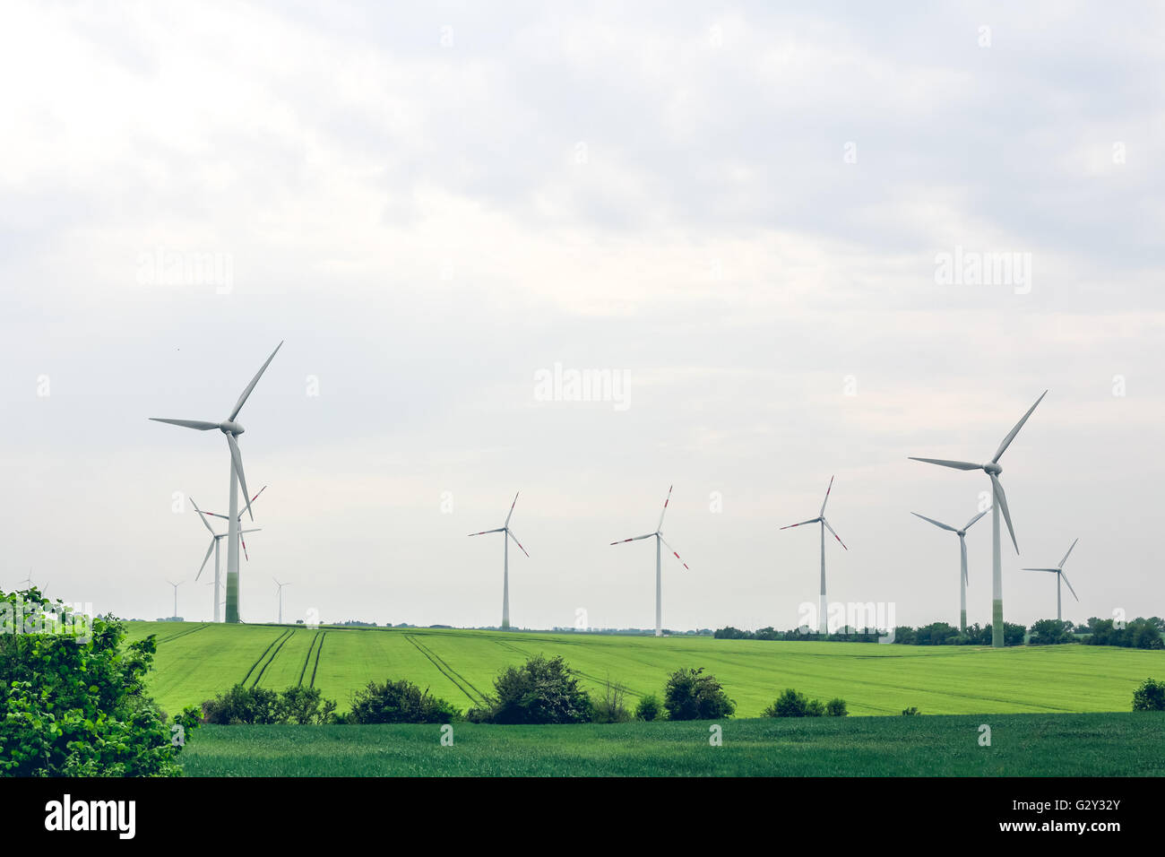 Windmill generator in wide yard Stock Photo - Alamy