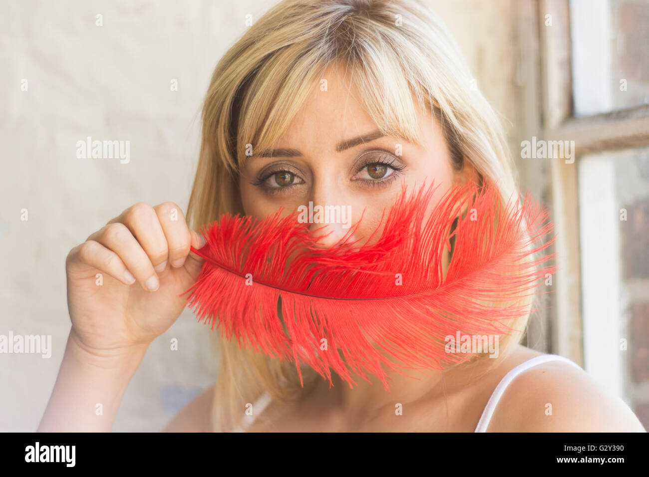 Female with feather hi-res stock photography and images - Alamy