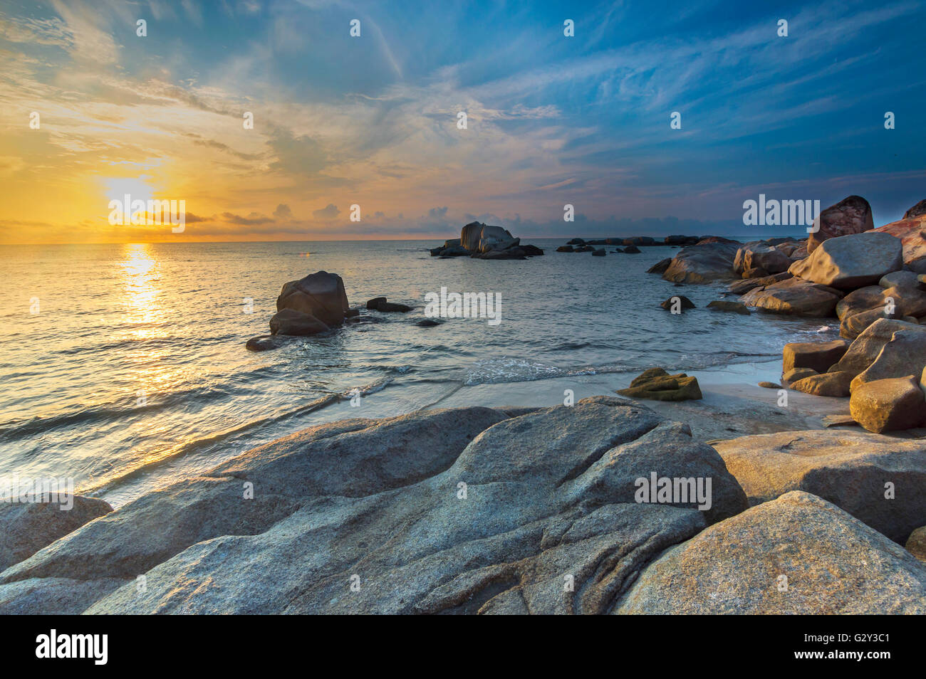 Beach rock and wave with sunrise skies background Stock Photo - Alamy