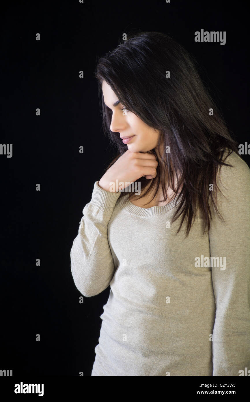 Thoughtful woman hand on chin Stock Photo - Alamy